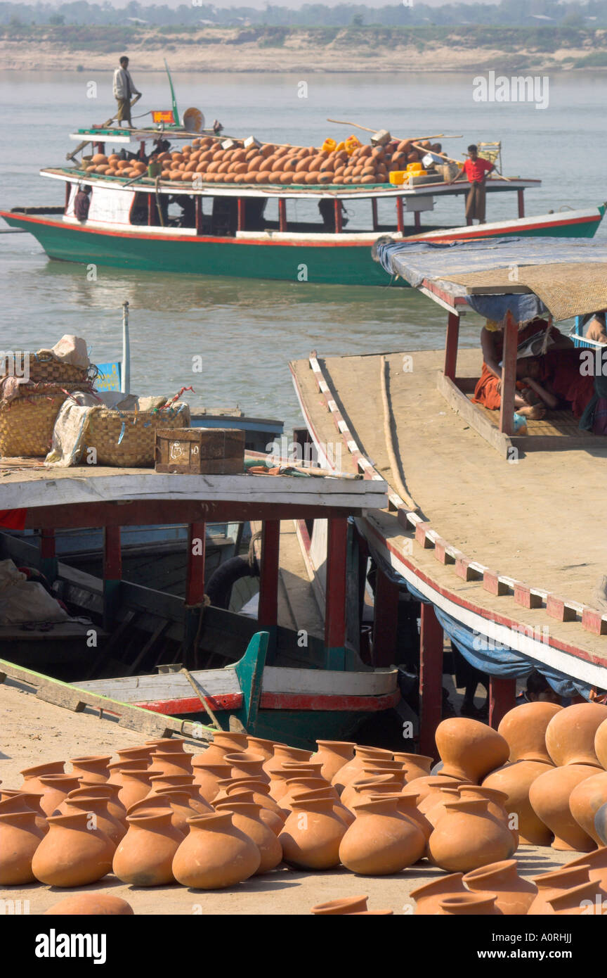 Wooden boats transporting pottery on the Ayeryarwady Irrawaddy River ...