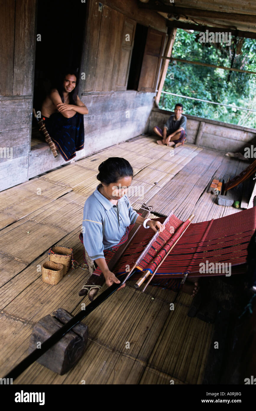 Ngada woman weaving ikat cloth Bena Village Flores Indonesia Southeast ...