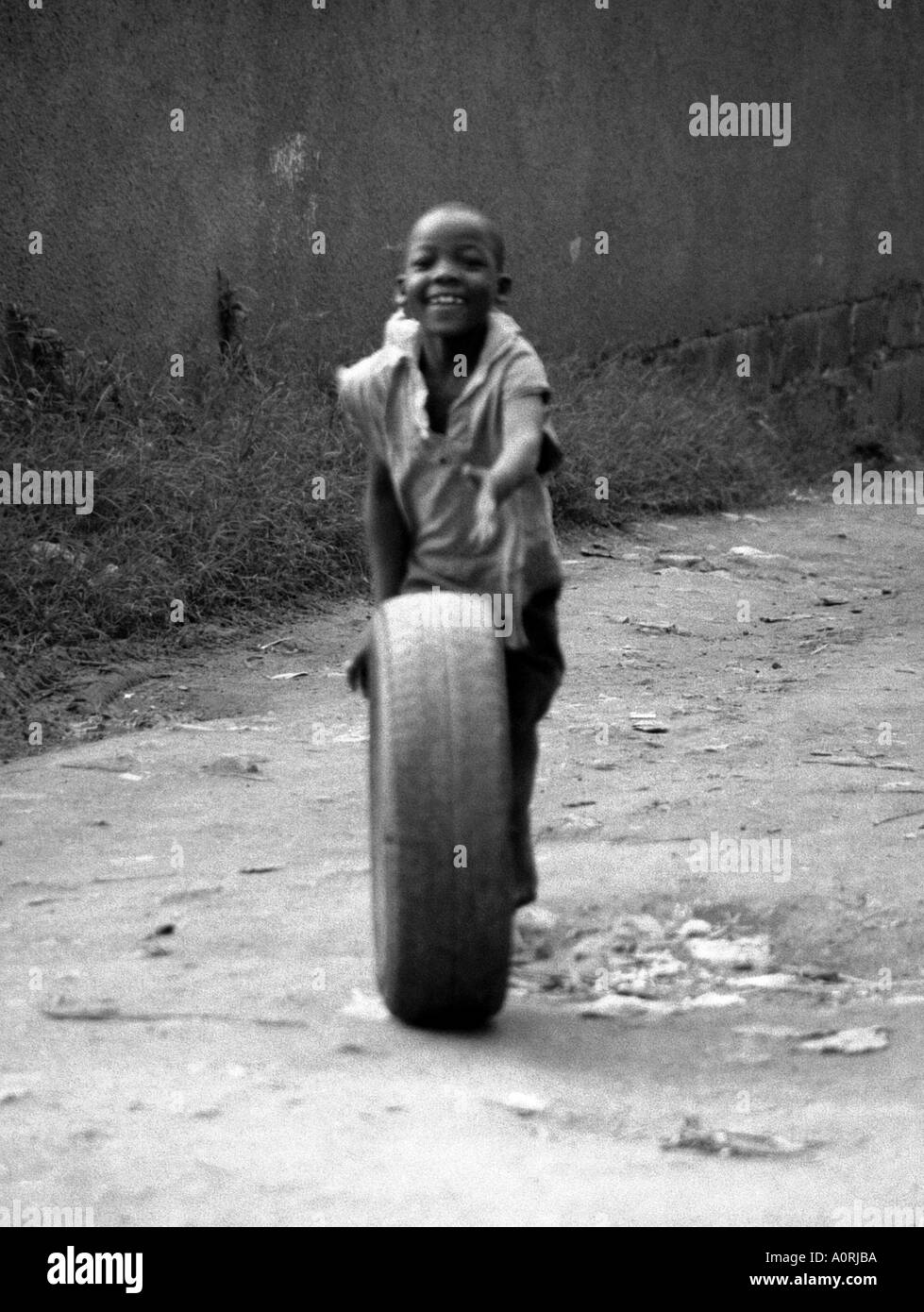 Portrait boy pose play outdoor poor look watch smile happy laugh car ...