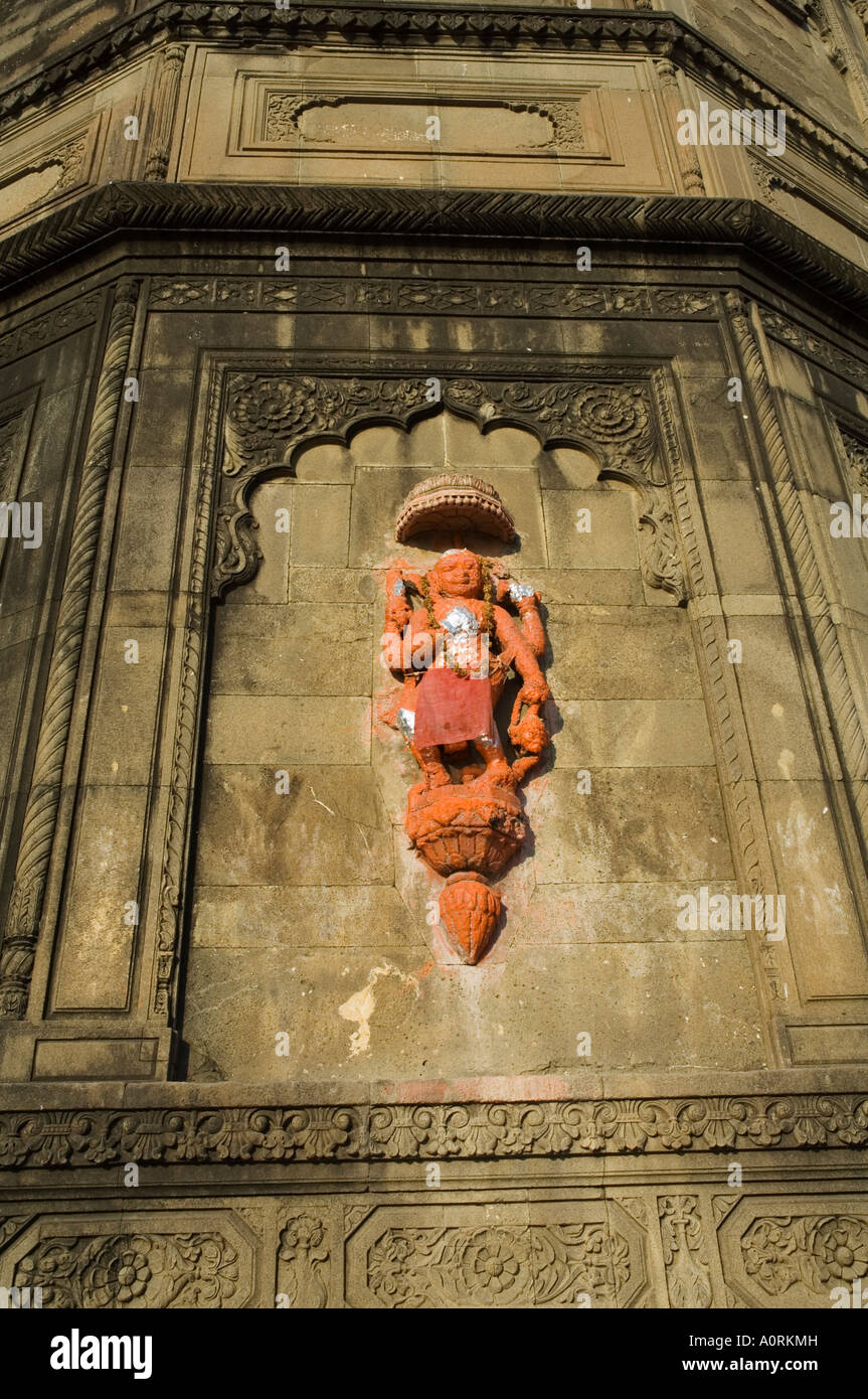 Hindu temple god on wall on banks of the Narmada River Maheshwar Madhya ...