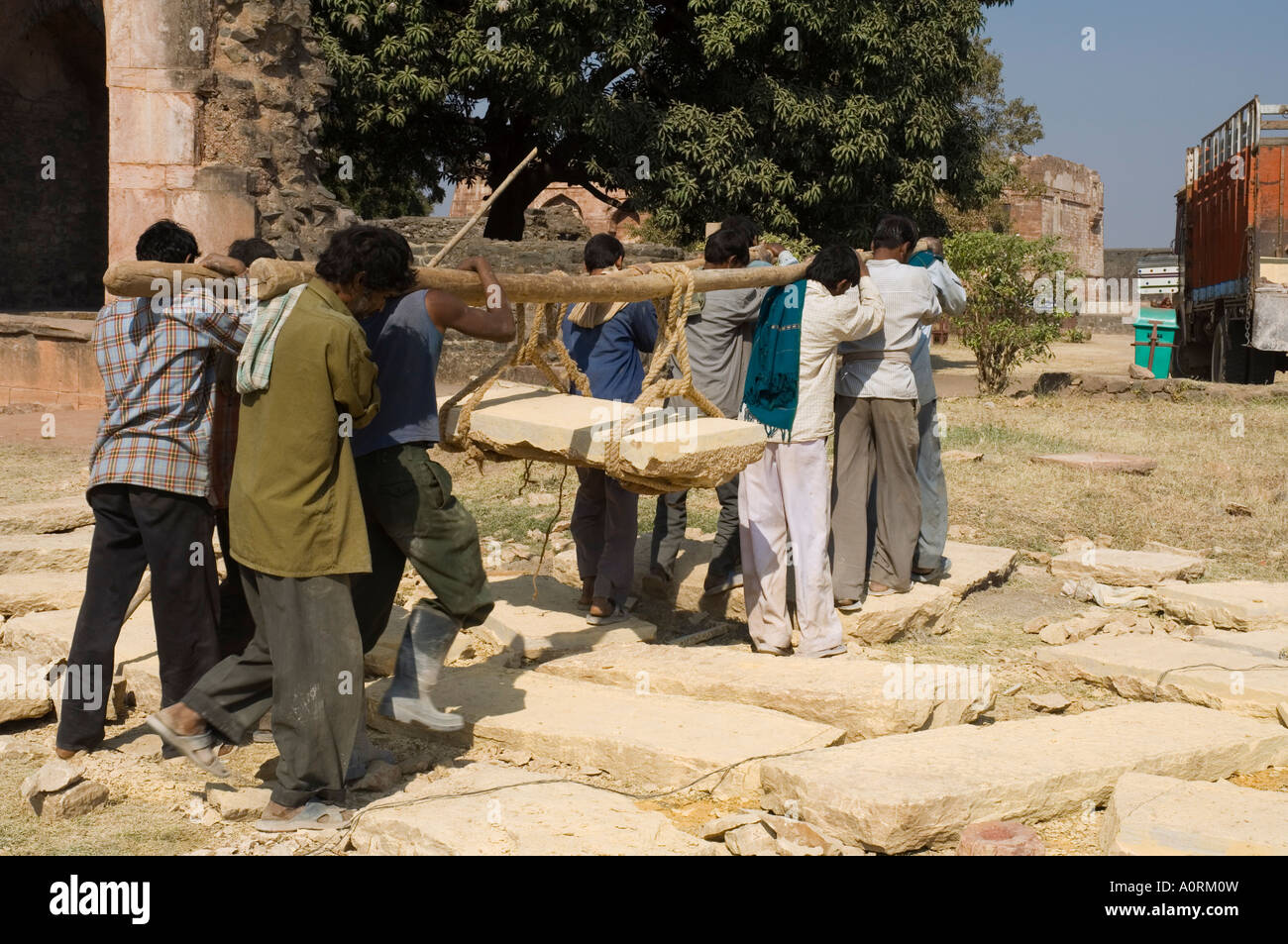 Lifting heavy stone hi-res stock photography and images - Alamy