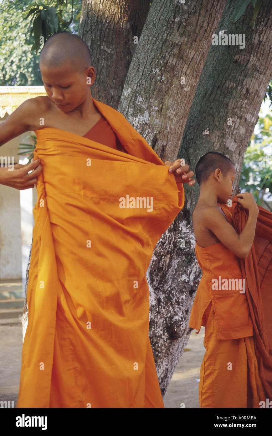 young buddhist monks putting on their robes kandal province cambodia ...