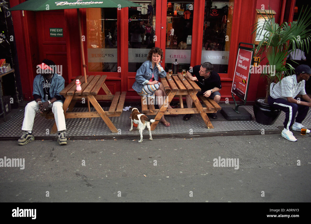 UK London Mixed expressions outside bar in Camden High Street Stock ...