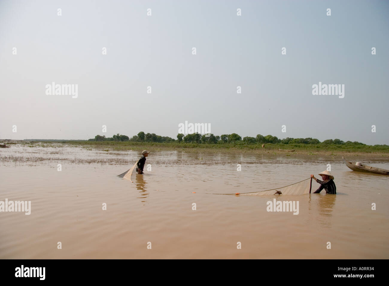 Men Fishing with Net Stock Photo - Alamy