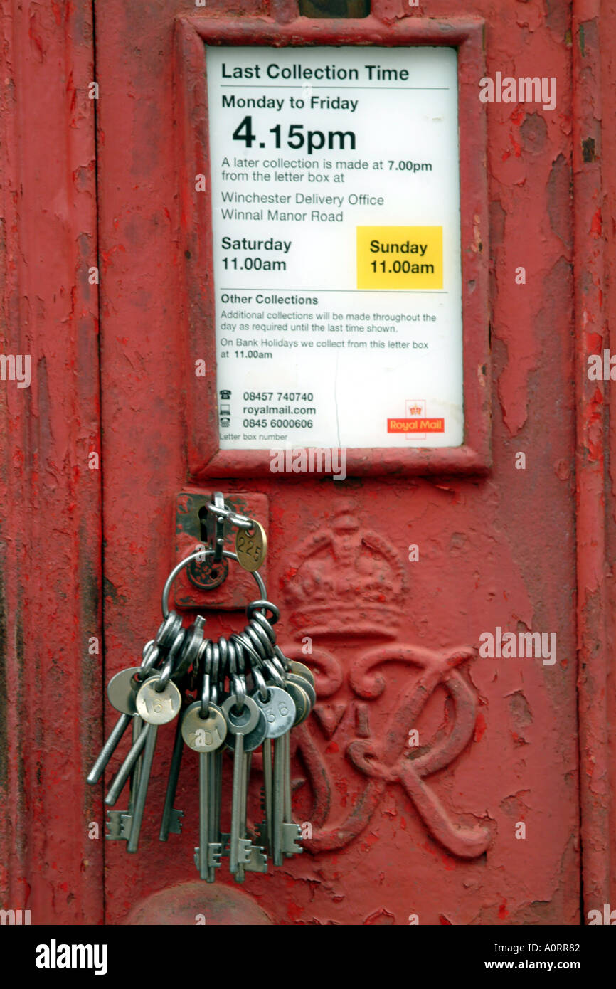 Red English royal mail letter box with keys in lock Stock Photo - Alamy