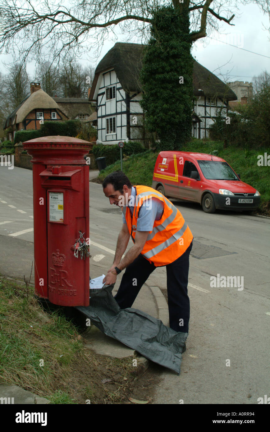 English postman uniform hi-res stock photography and images - Alamy