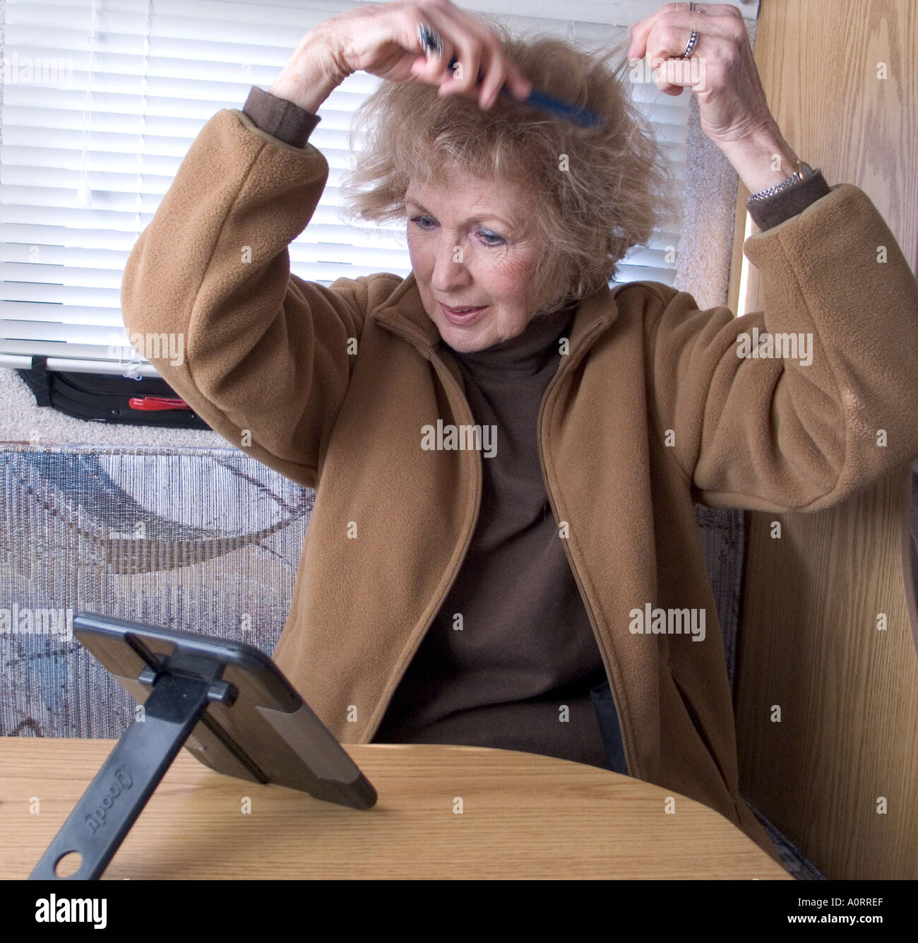 Lady fix hair hi-res stock photography and images - Alamy