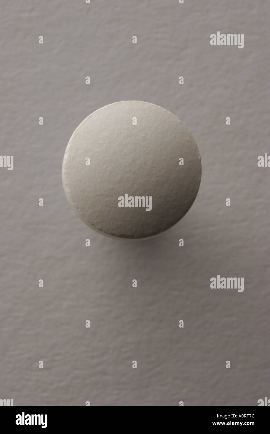 still life image of pill close up on a white background looking from ...