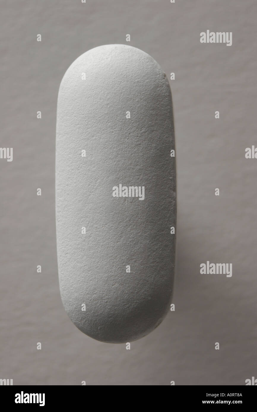 still life image of pill close up on a white background looking from ...