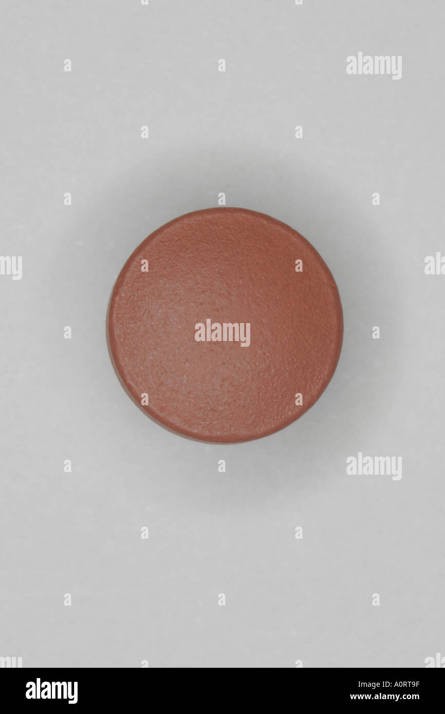 still life image of pill close up on a white background looking from ...