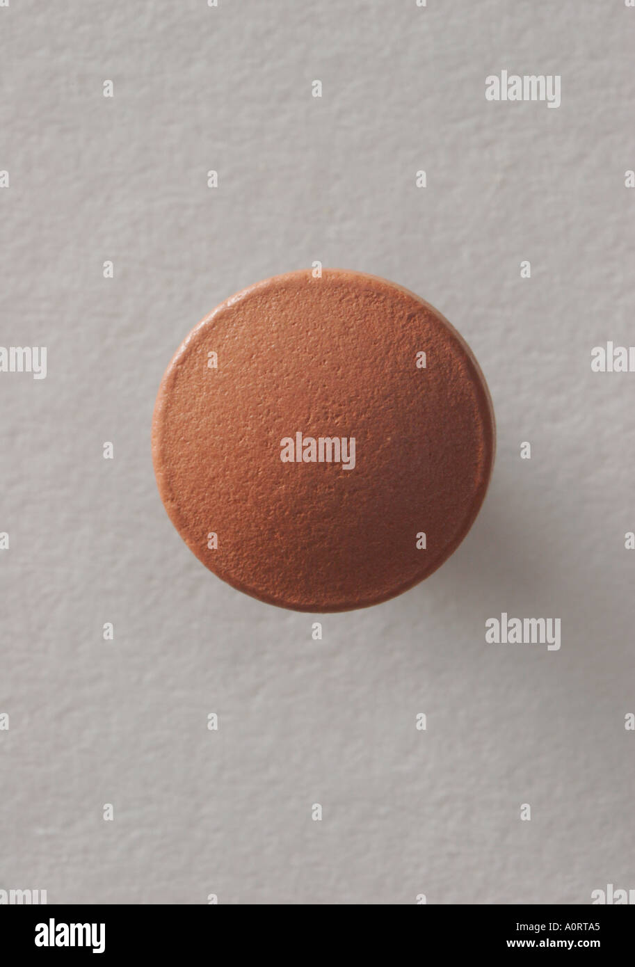 still life image of a pill close up by itself on a white background ...