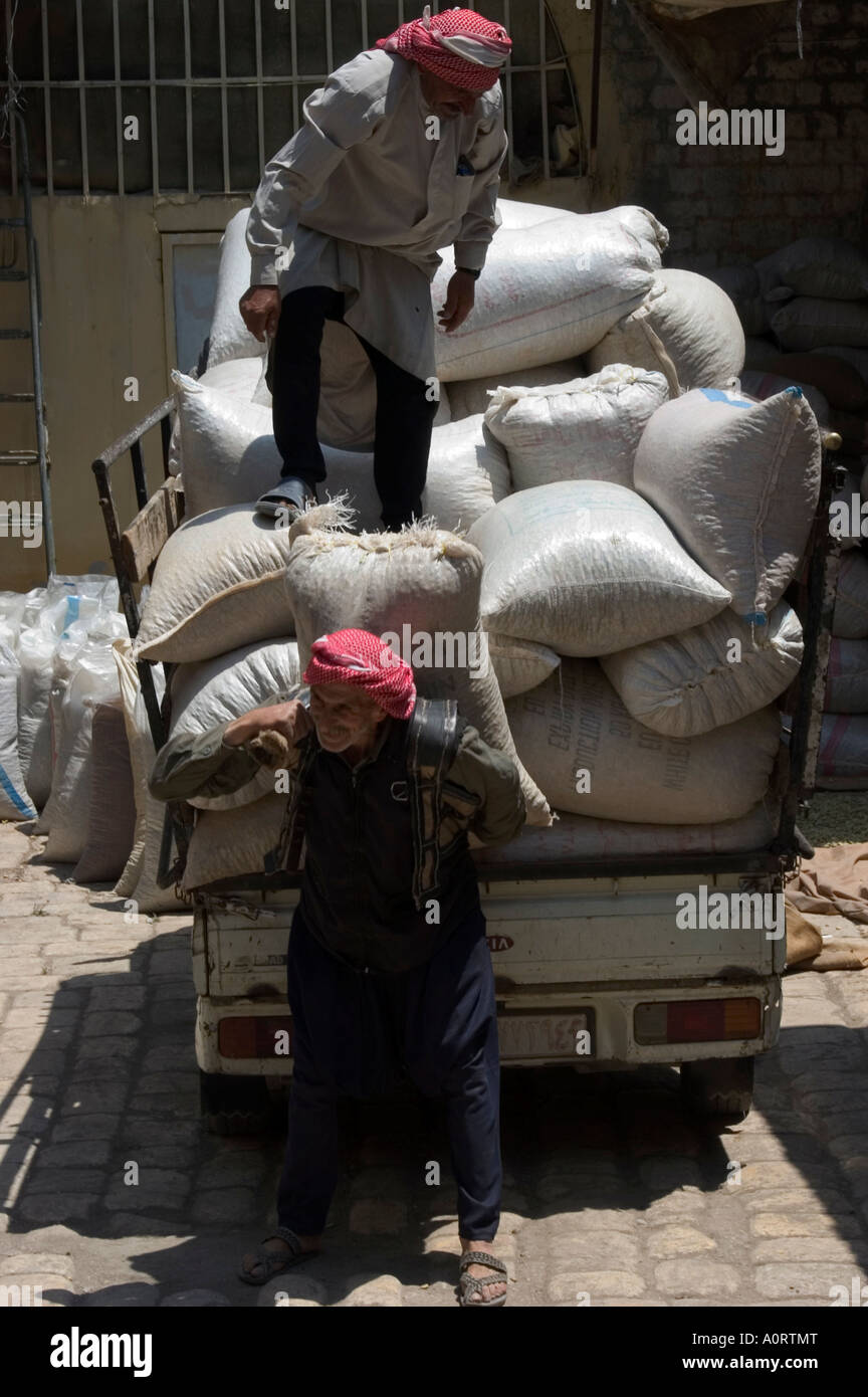 Men loading grain Aleppo Haleb Syria Middle East Stock Photo - Alamy