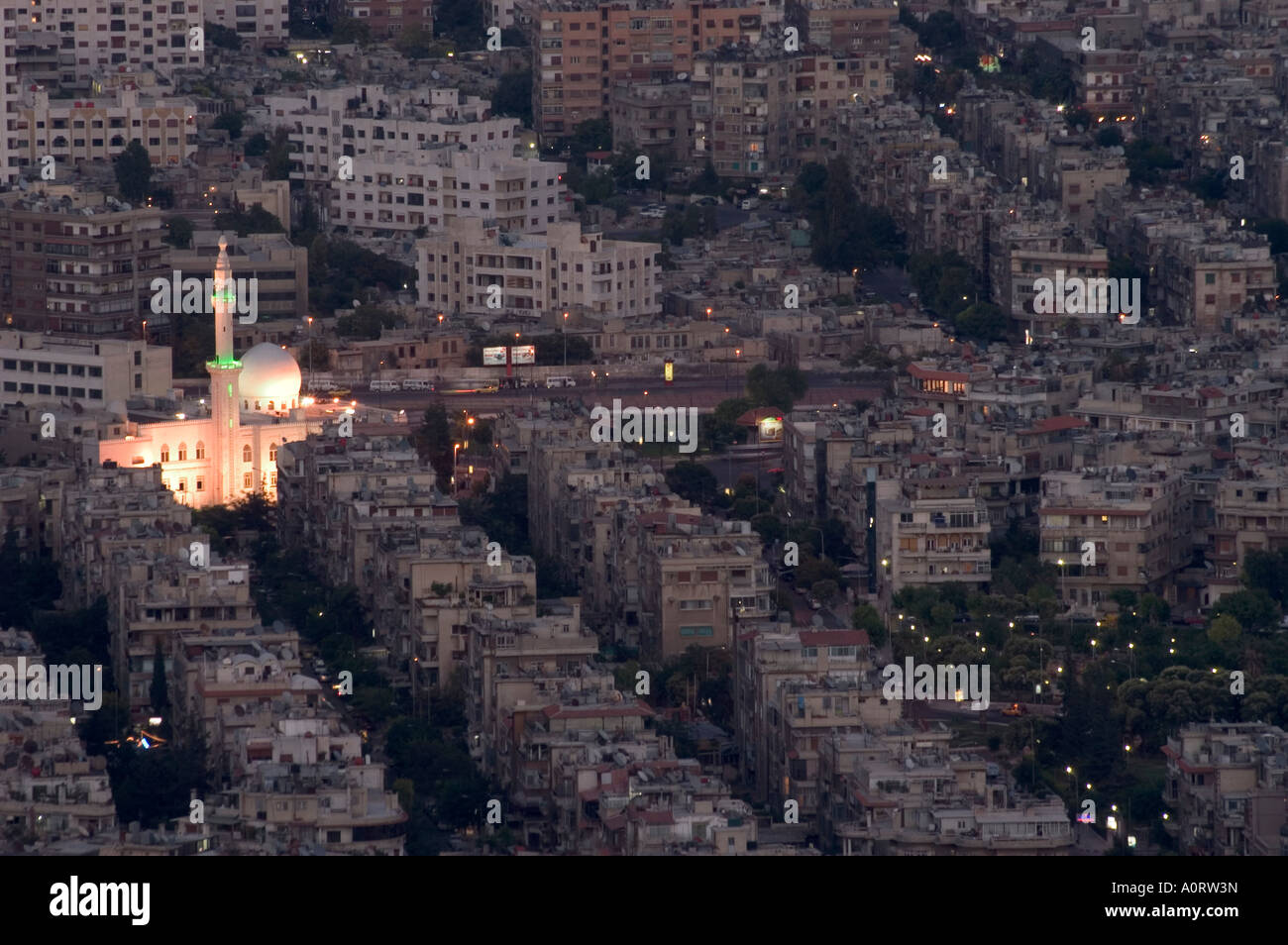 Aerial view of city at night including a floodlit mosque Damascus Syria ...