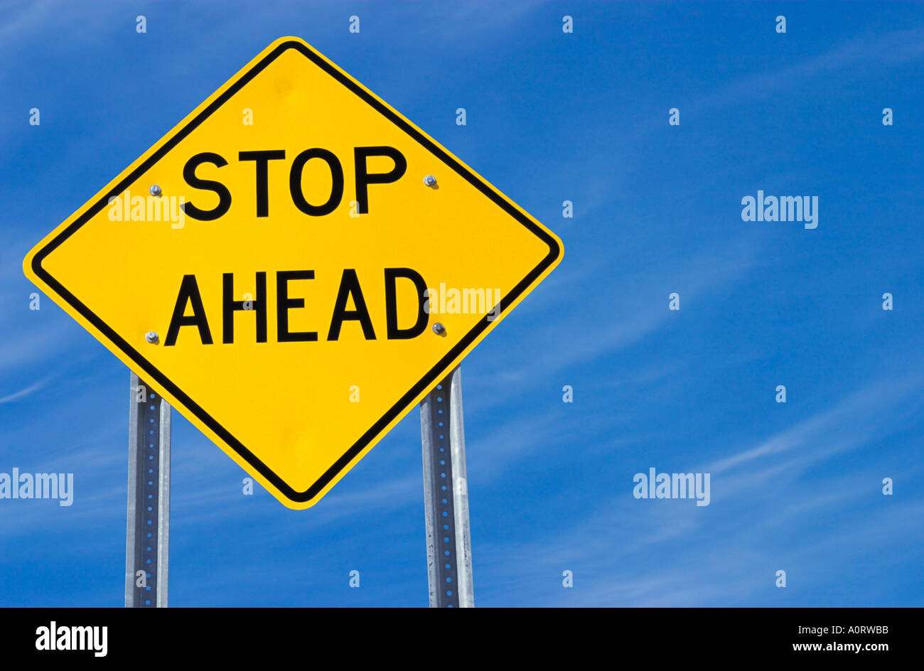STOP AHEAD road sign with blue sky background Stock Photo - Alamy