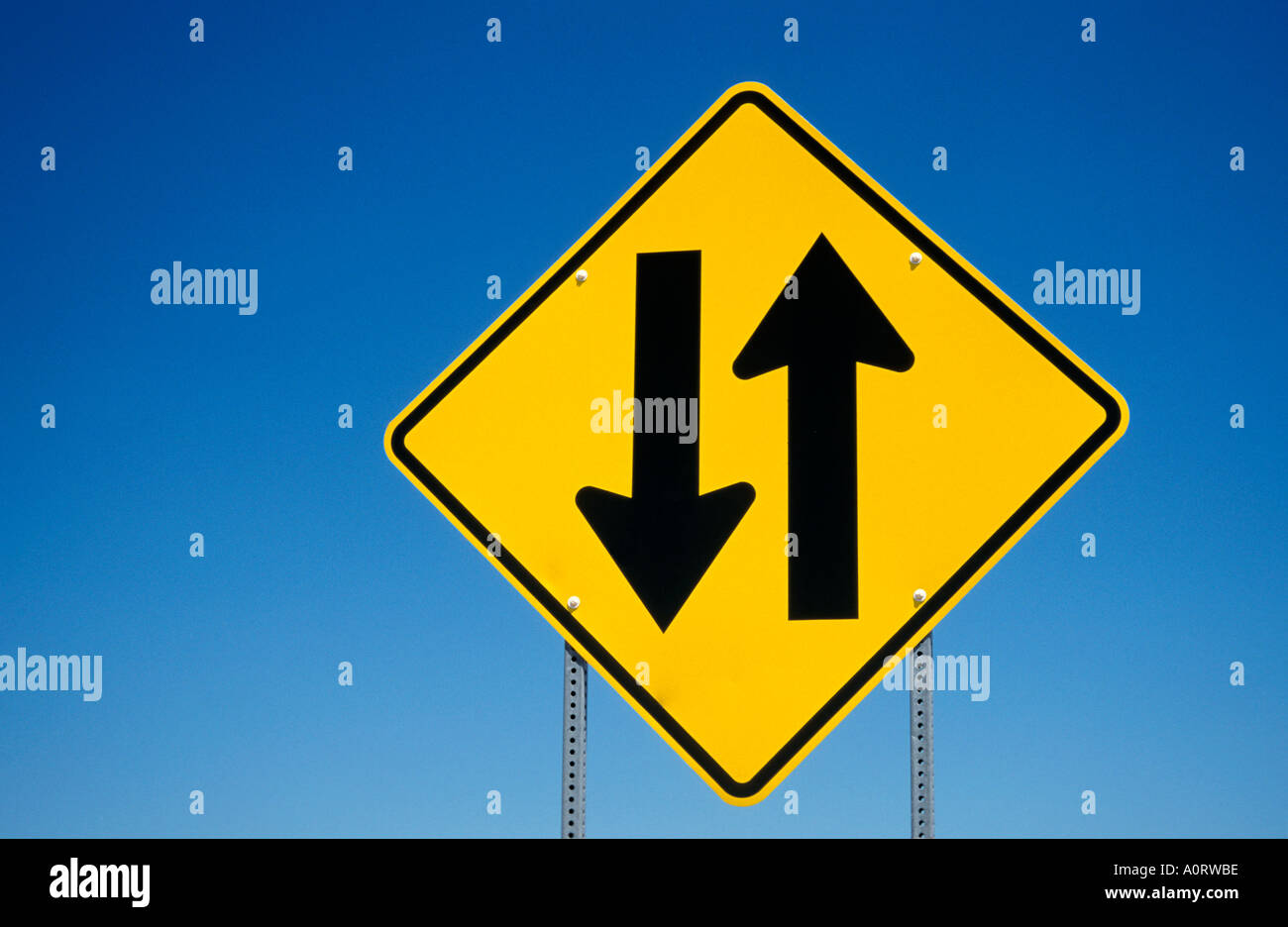 Two way traffic ahead road sign with opposing directional arrows Stock ...