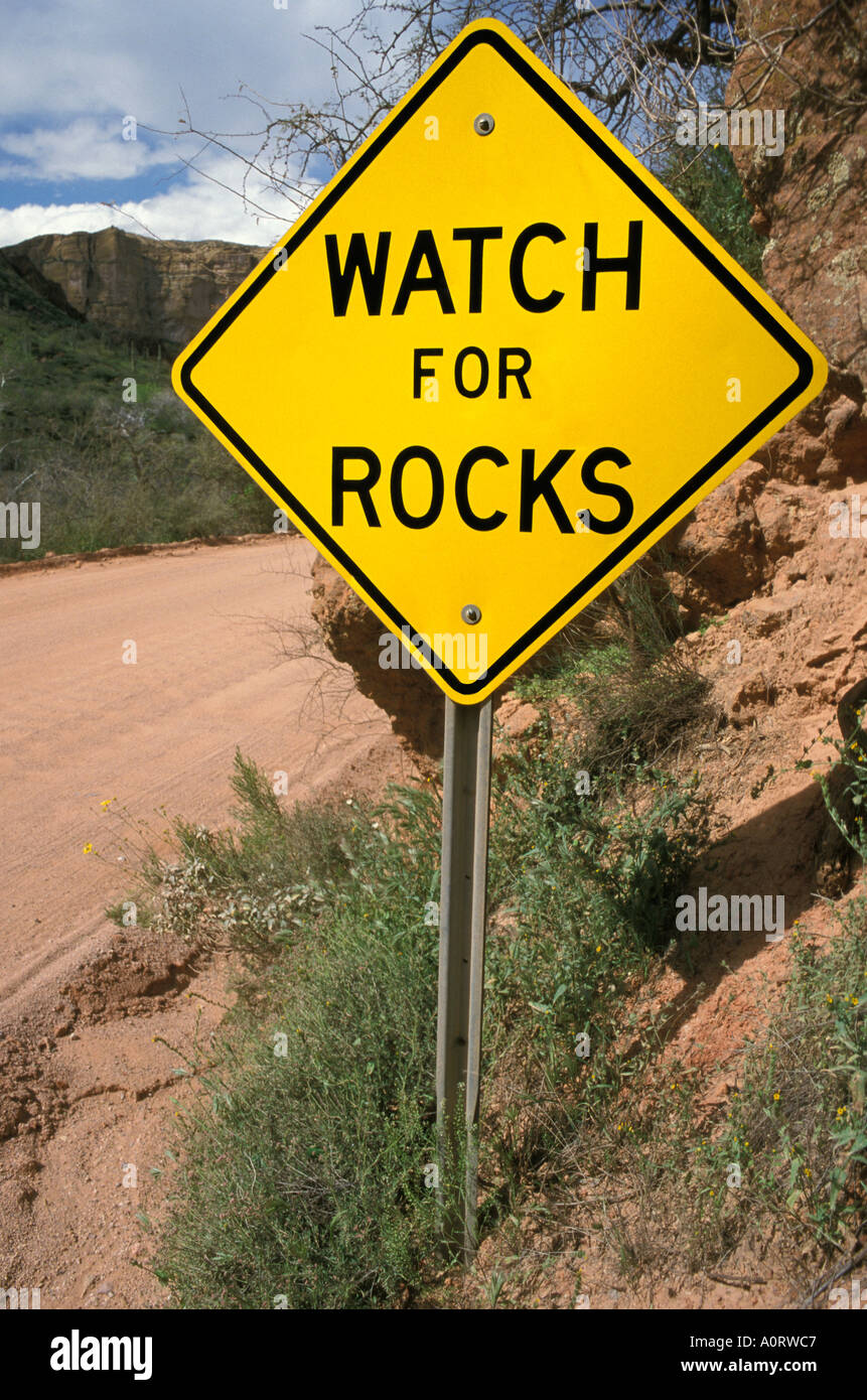 WATCH FOR ROCKS warning sign Stock Photo - Alamy