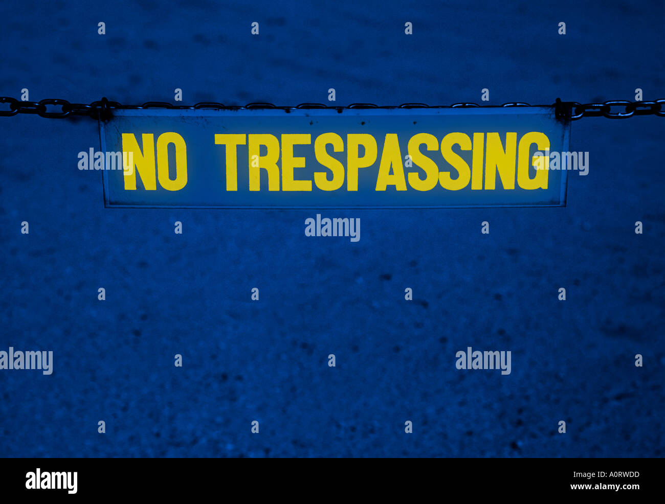 NO TRESPASSING sign hanging on a chain Stock Photo - Alamy