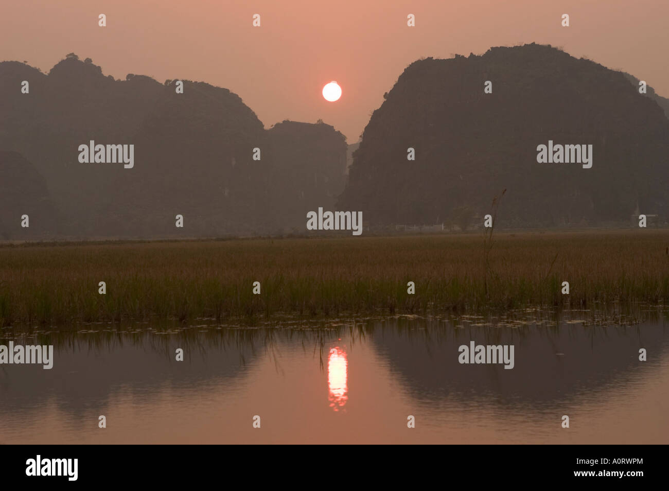 Sunset limestone mountain scenery Tam Coc Ninh Binh south of Hanoi ...