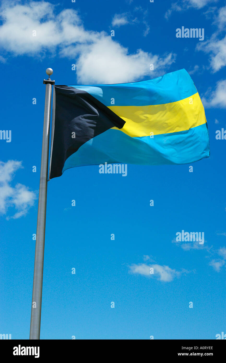 The Bahamian flag flying in the wind with a blue sky background Stock ...