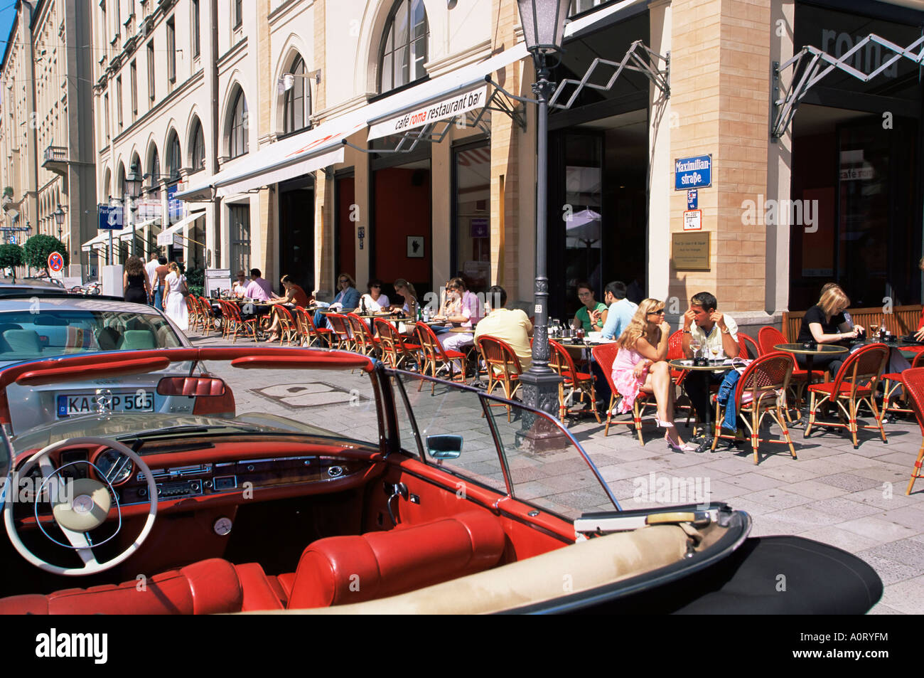 People sitting outside Cafe Roma on Maximilianstrasse Munich Bavaria ...