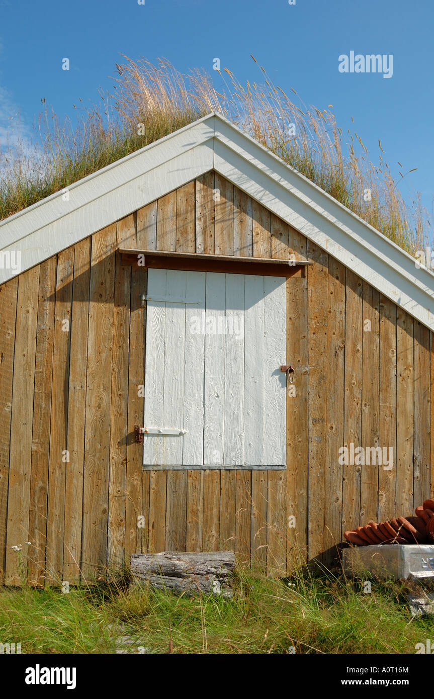 Turf roofed wooden hut Kvaloya island west of Tromso Norway Scandinavia ...