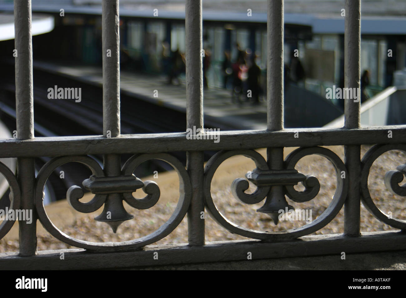 decorative iron railing on a bridge over a train station paris france ...