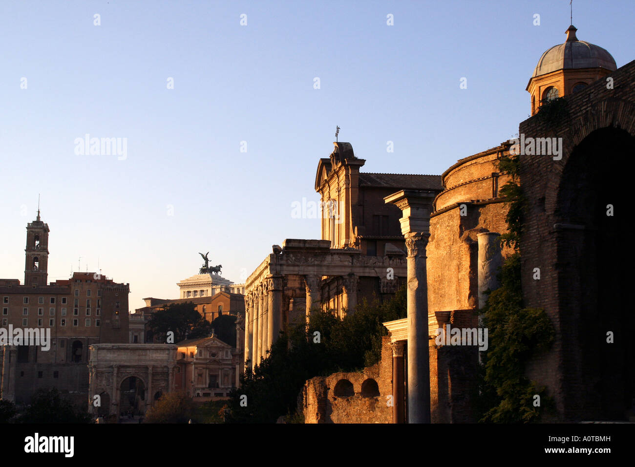 A view of the Roman Forum at sunset in Rome Italy Stock Photo - Alamy