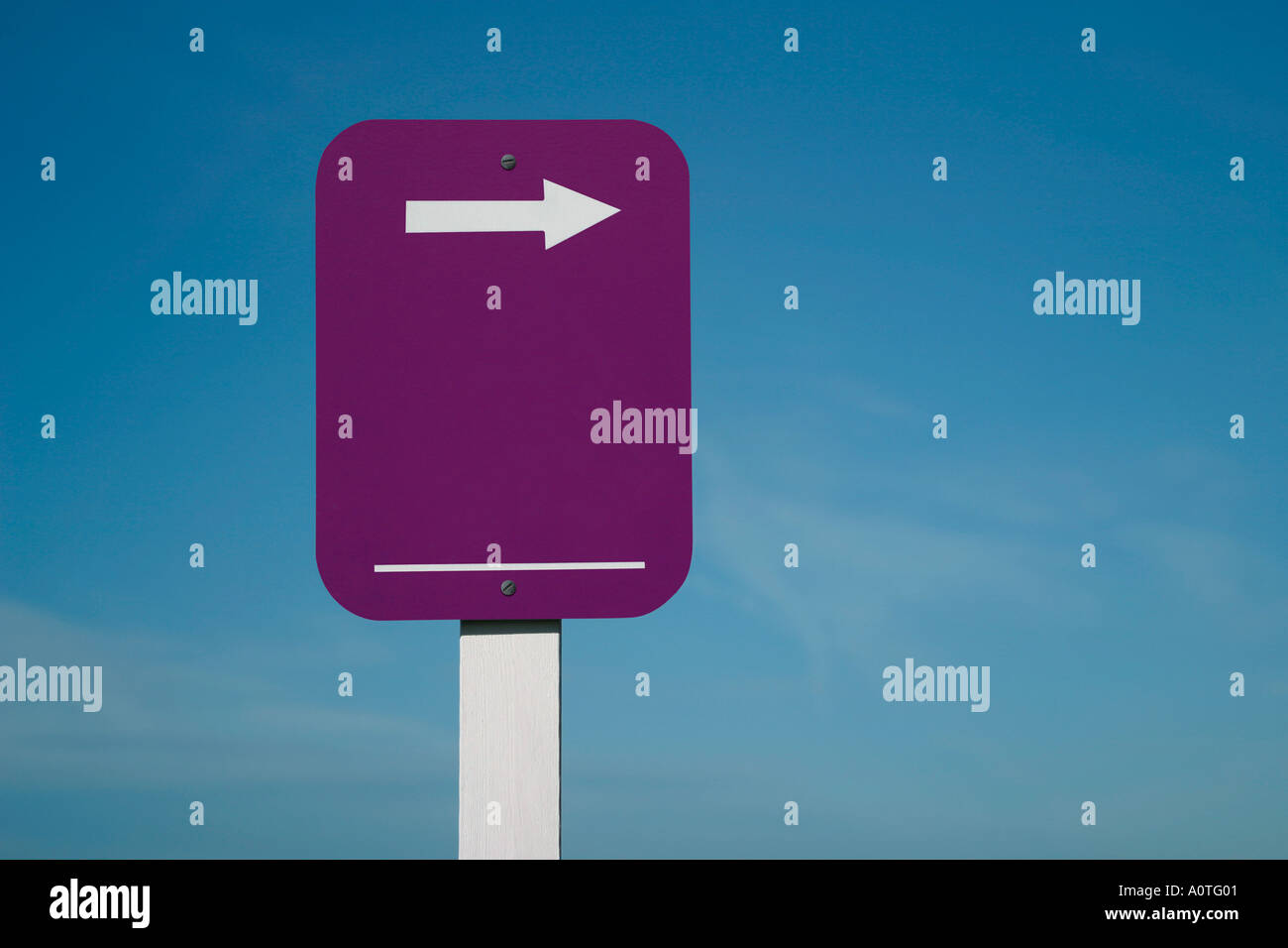 Purple sign with a white directional arrow pointing right and with a ...