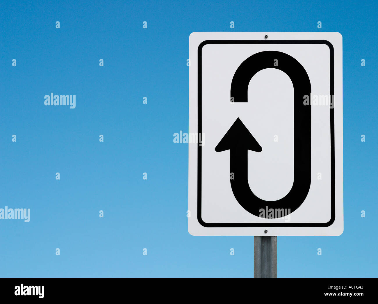 Sign with circular black arrow suggesting repetition or an endless loop ...