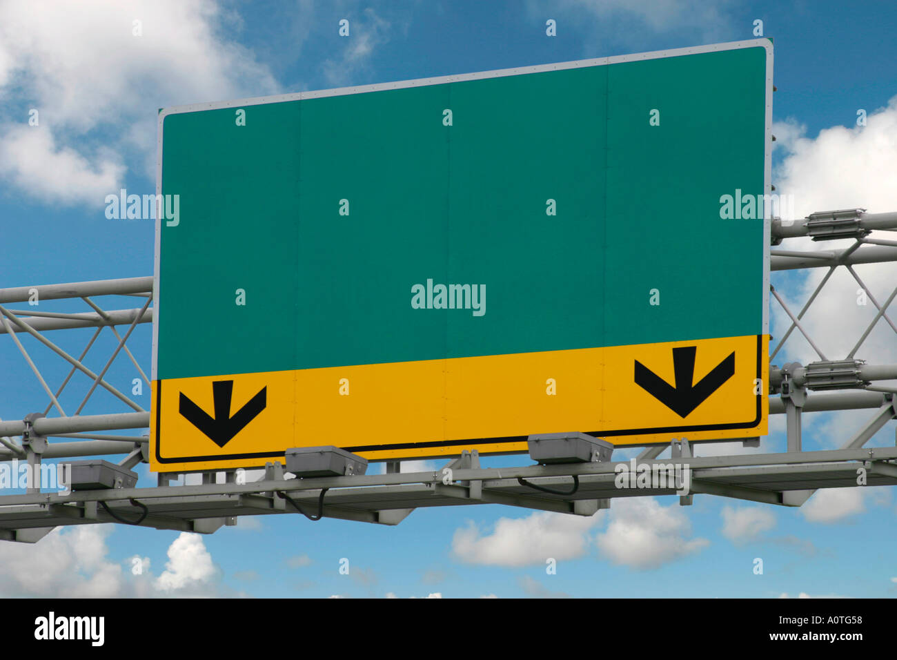 Blank expressway overhead sign with arrows pointing down Stock Photo ...