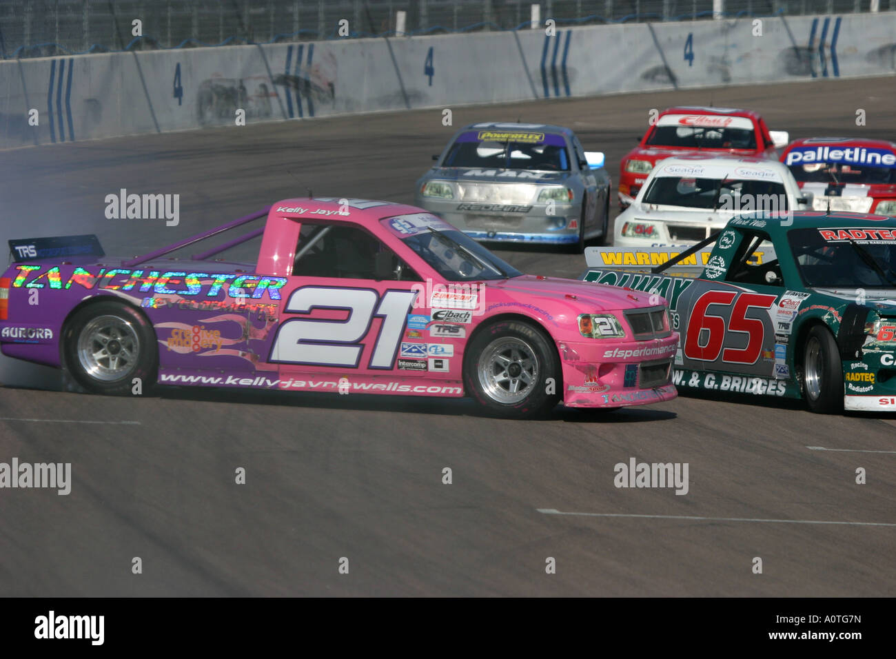 Racing pick up truck spinning out Stock Photo - Alamy