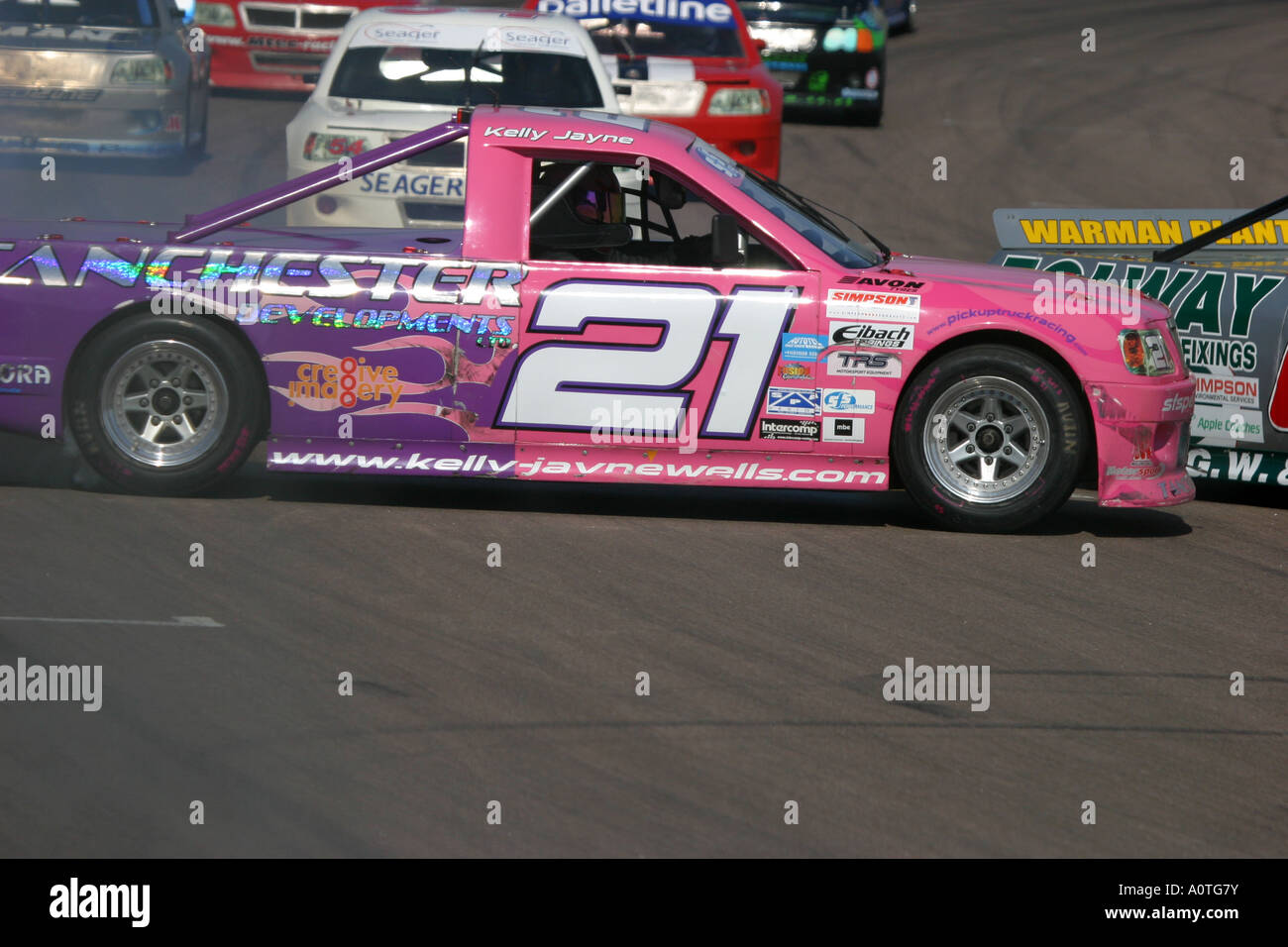 Racing pick up truck spinning out Stock Photo - Alamy