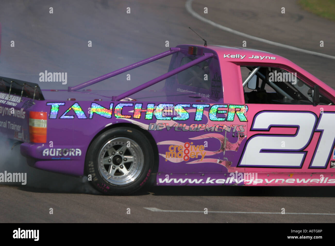 Racing pick up truck spinning out Stock Photo - Alamy