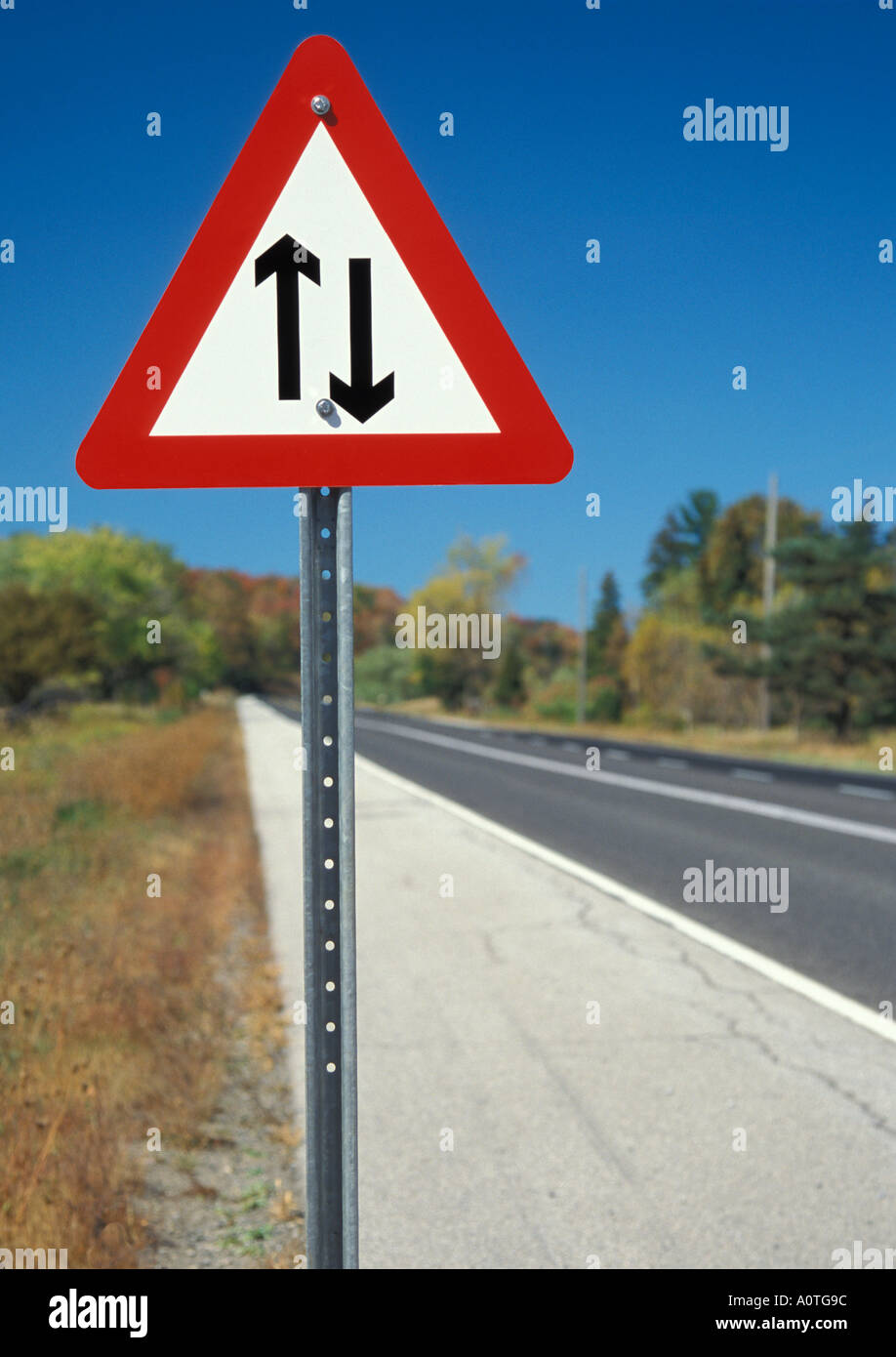 Two way traffic road sign Stock Photo - Alamy
