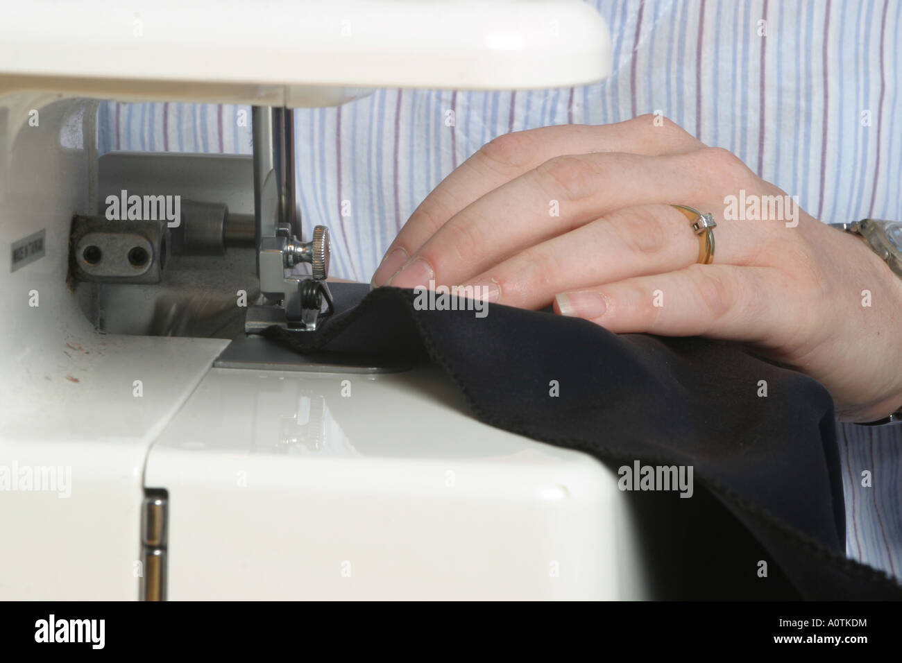 Womans hand sewing clothes hi-res stock photography and images - Alamy