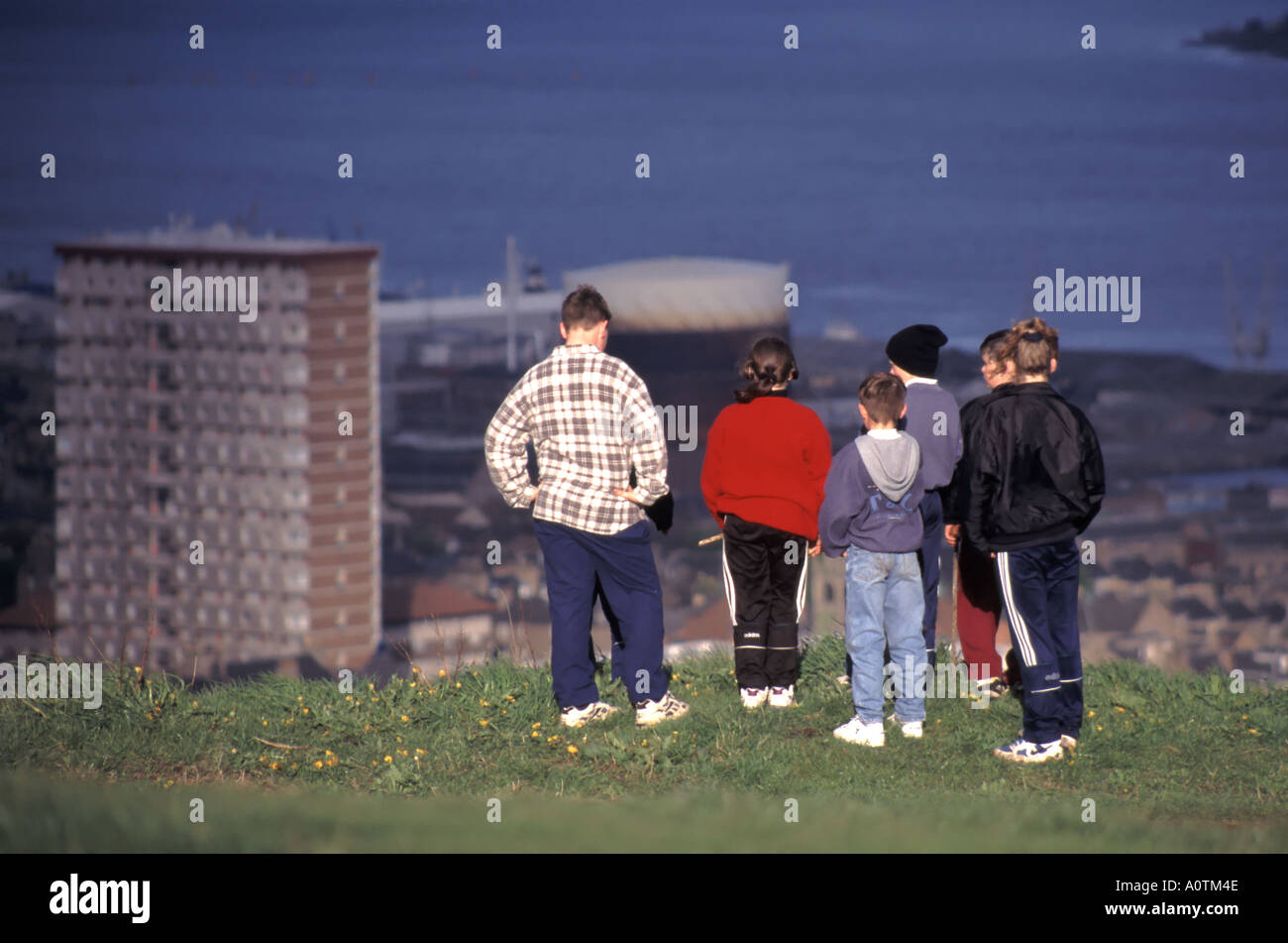 Dundee youngsters looking down on urban areas including high rise flats ...