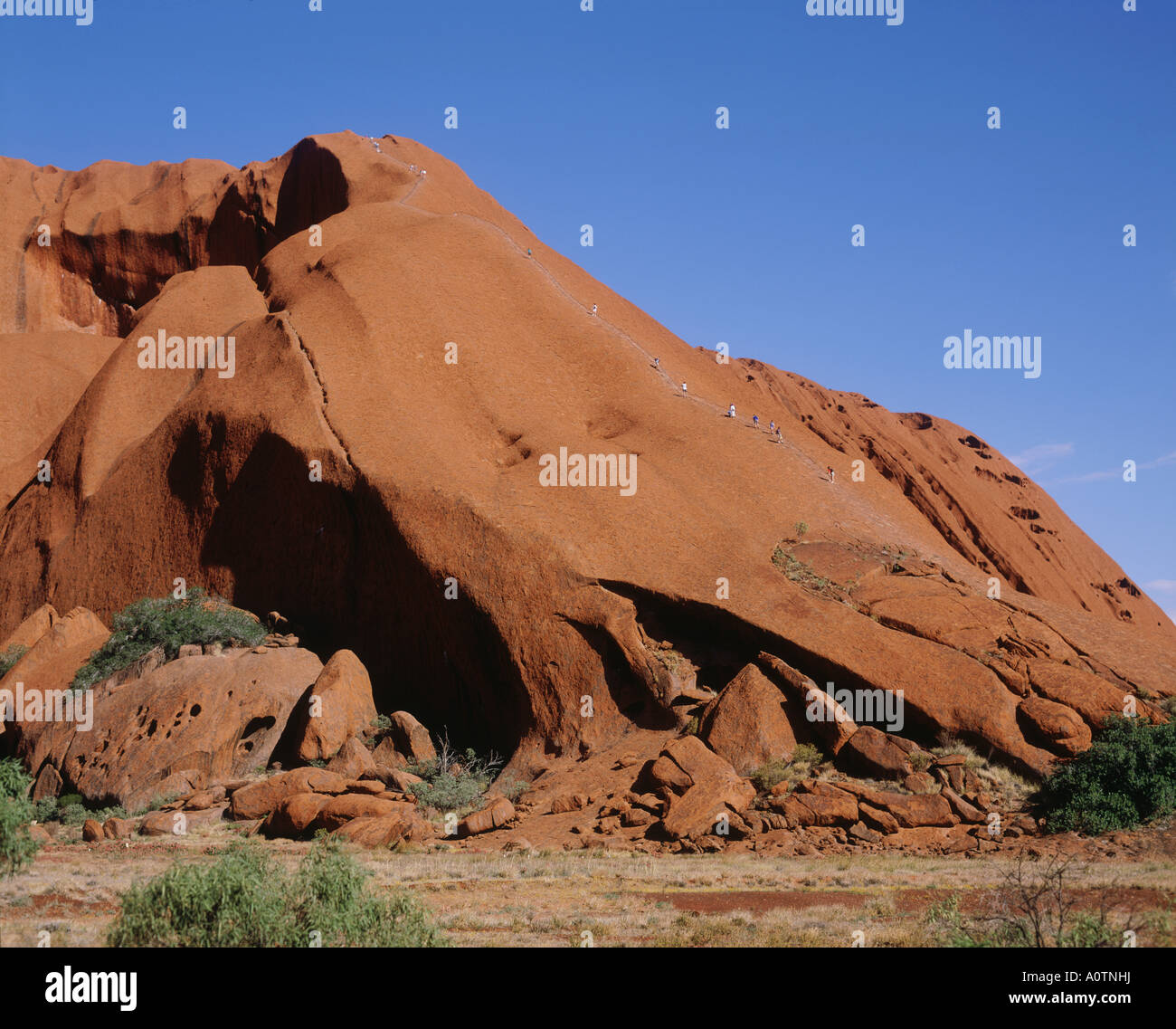 Climbing Ayres Rock World Heritage Stock Photo - Alamy