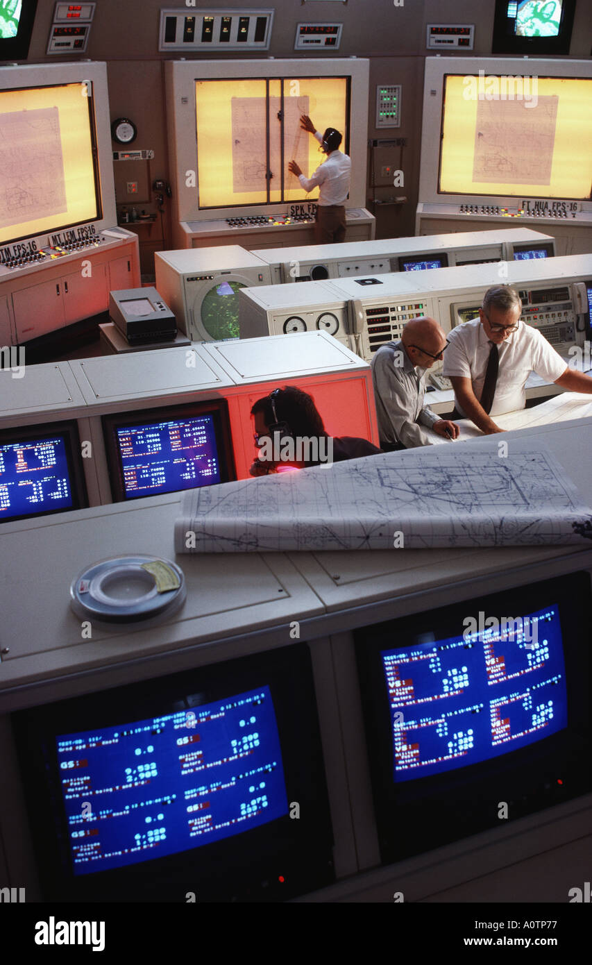 Man cross country skiing on snow in the winter using a map and handheld ...