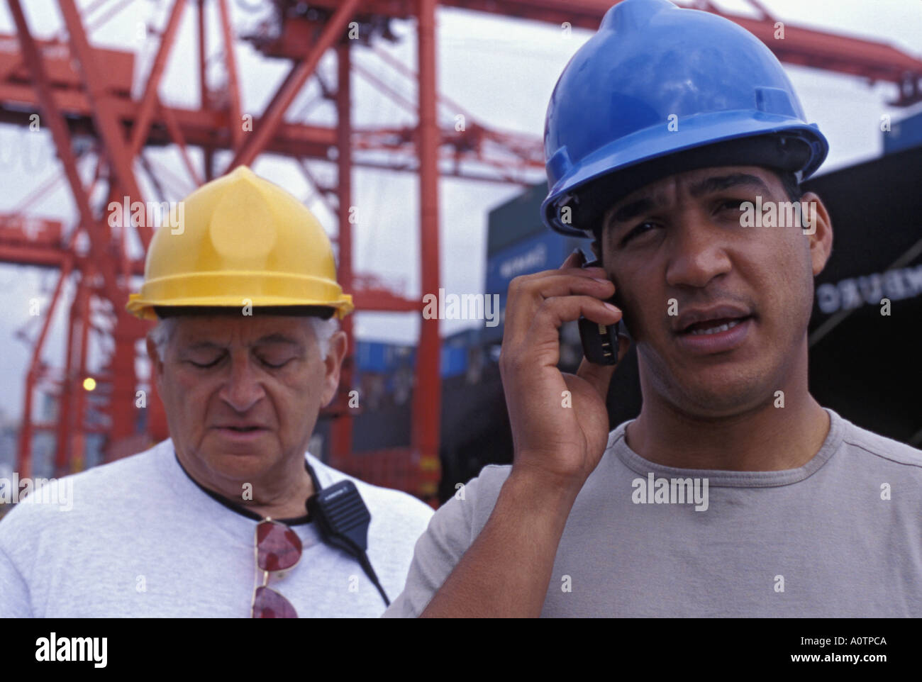 Longshoreman talking cargo ship dock hi-res stock photography and ...