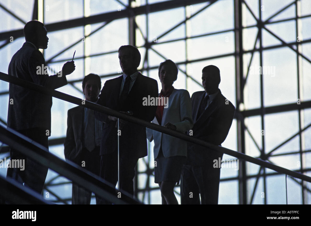 Woman addressing group of men hi-res stock photography and images - Alamy