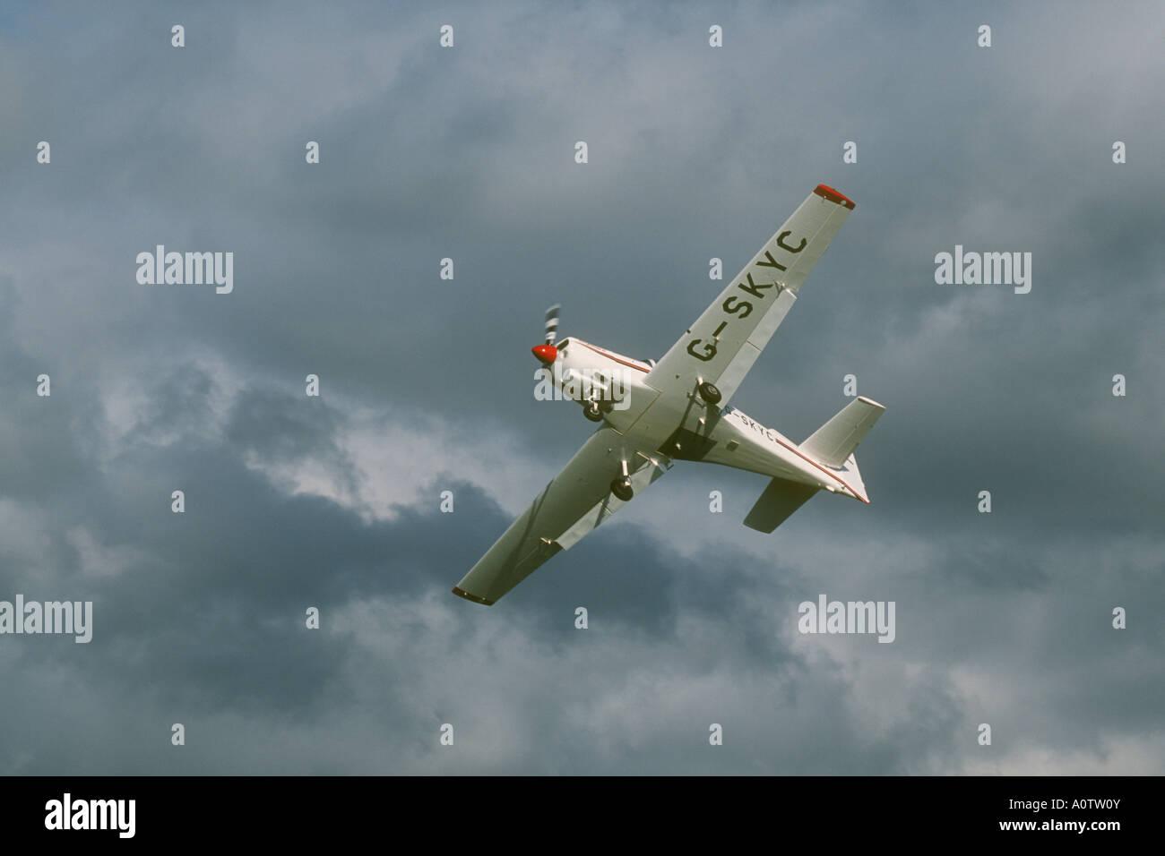 Slingsby T-67 Firefly G-SKYC in flight against a stormy sky at ...