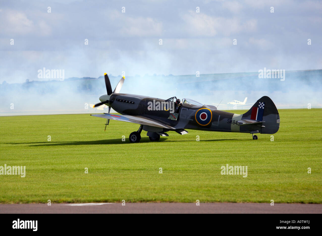 Mk 18 Spitfire SM845 landing at Duxford aerodrome with smoke in the ...