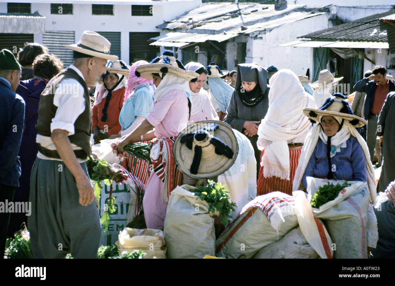 AFRICA MOROCCO TANGIER Berber women in traditional dress selling ...