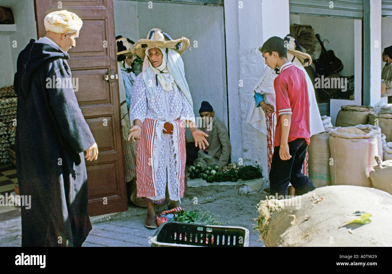 AFRICA MOROCCO TANGIER Berber women in traditional dress selling ...