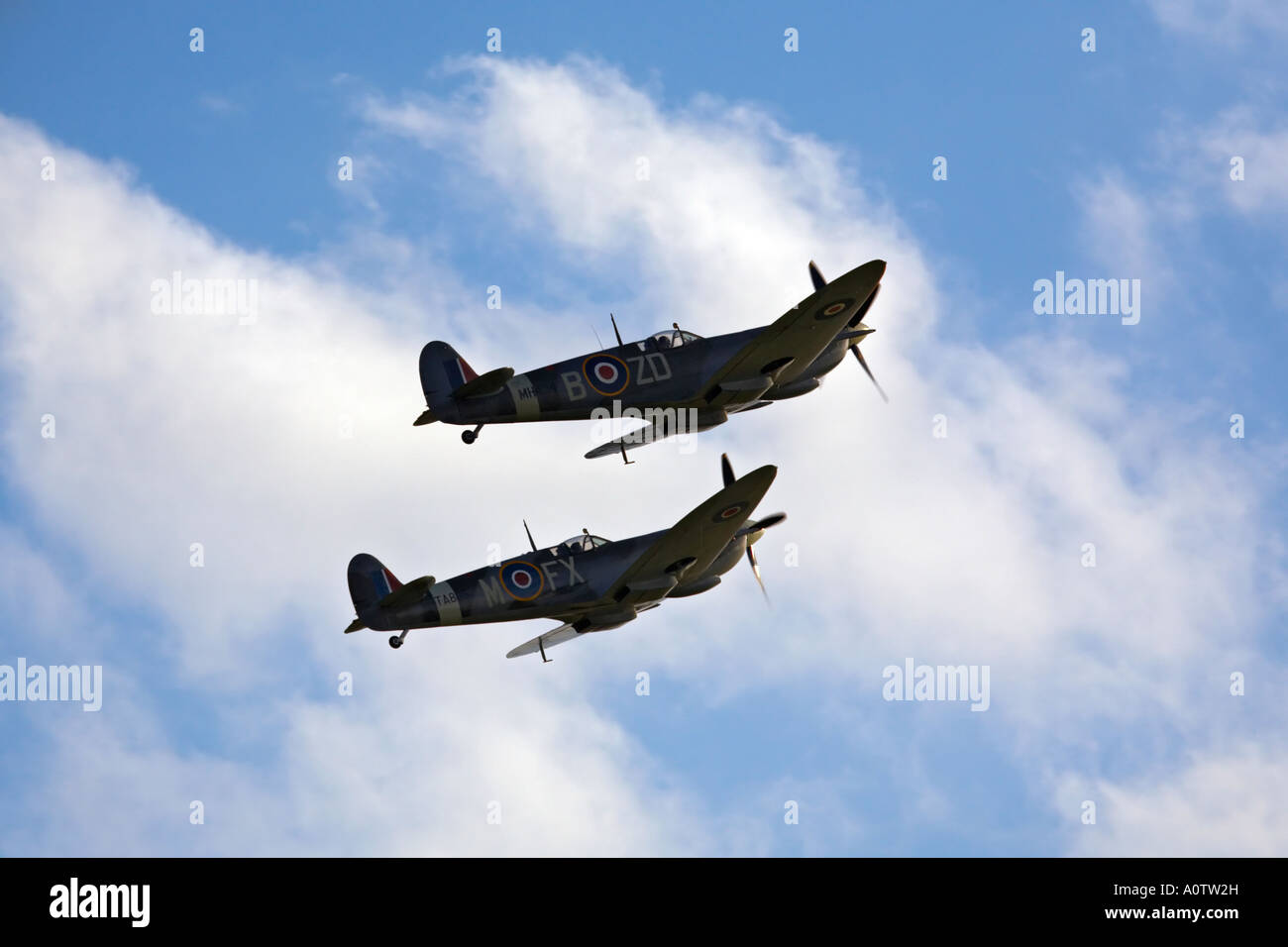 Two Spitfires in flight at Duxford Stock Photo - Alamy