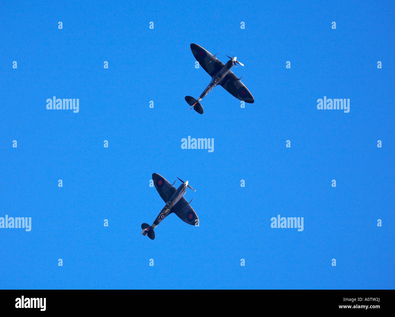 Two Spitfires in flight at Duxford Stock Photo - Alamy