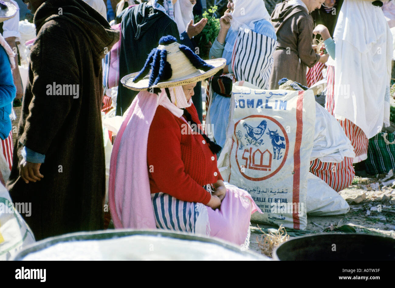 AFRICA MOROCCO TANGIER Berber women in traditional dress selling ...