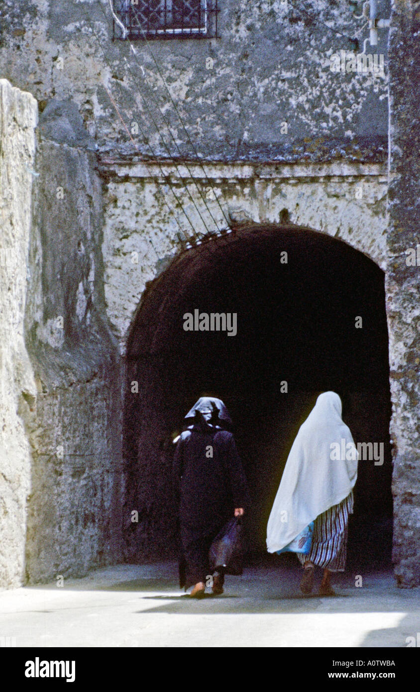 AFRICA MOROCCO TANGIER Muslim women in traditional veils walk through ...