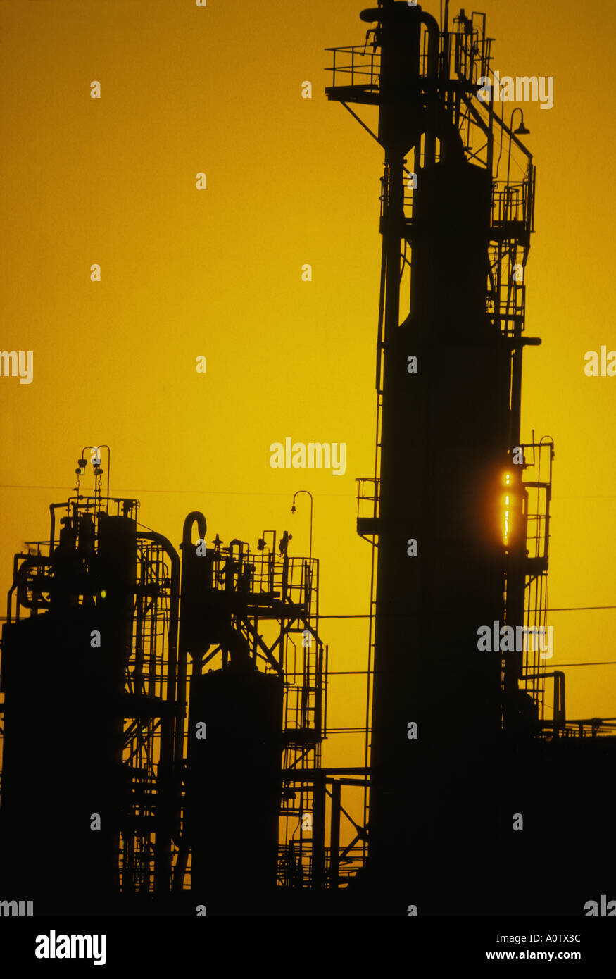 Fractionating towers at Texas petrochemical plant at sunset Stock Photo ...