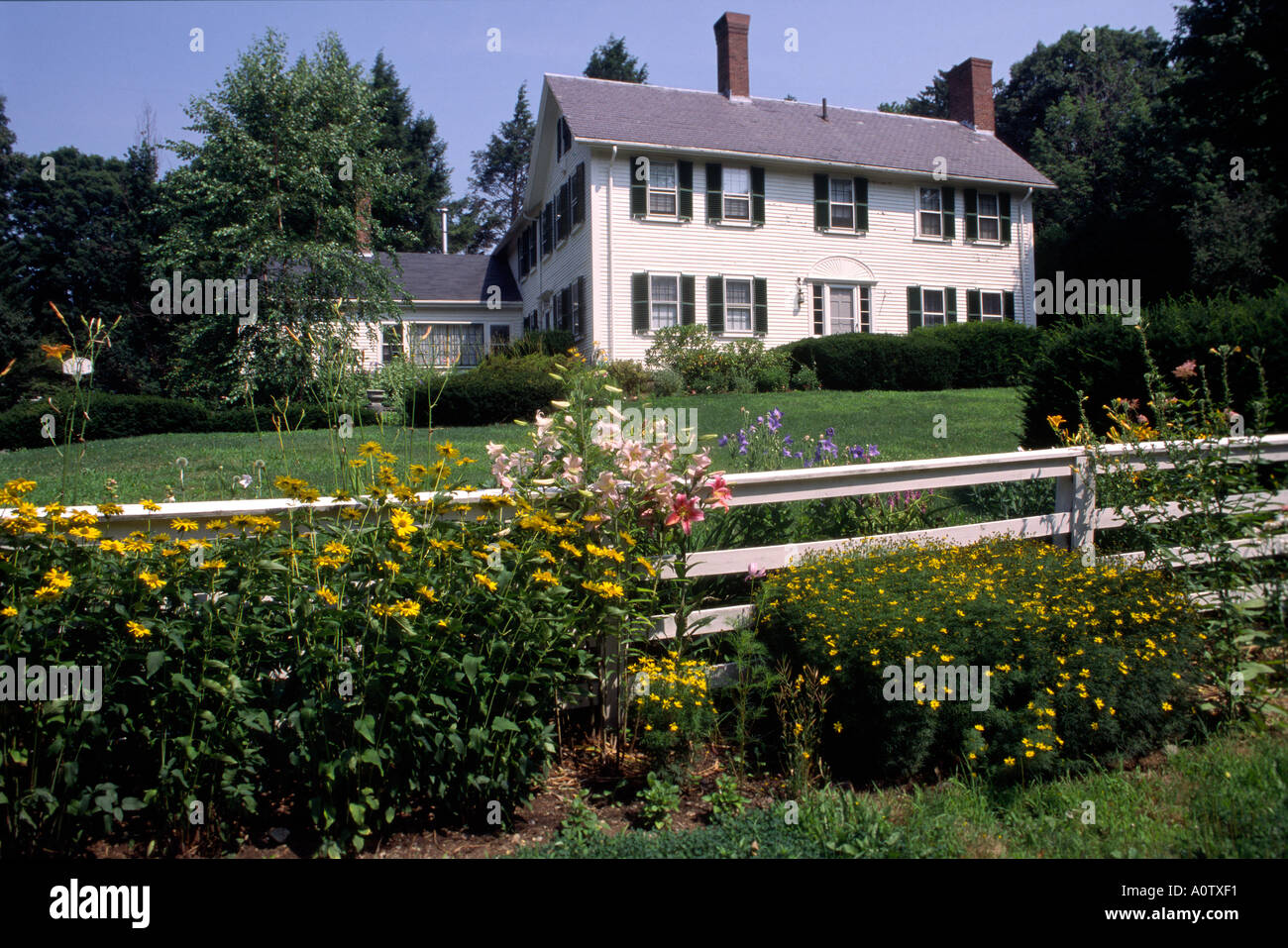 Colonial restoraton suburban house wood rail fence Stock Photo - Alamy